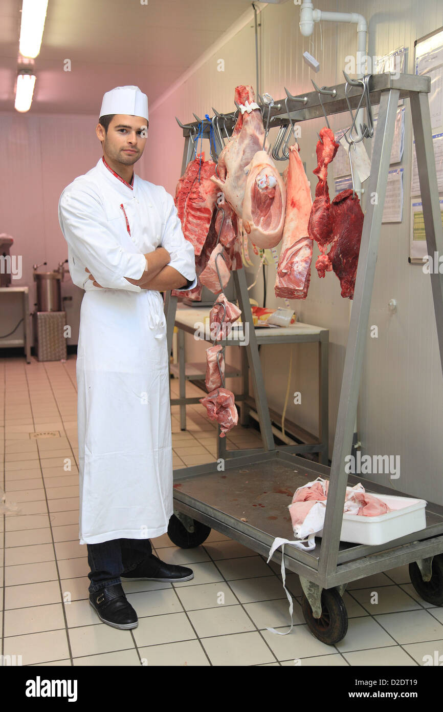 France, supermarket, young butcher Stock Photo - Alamy