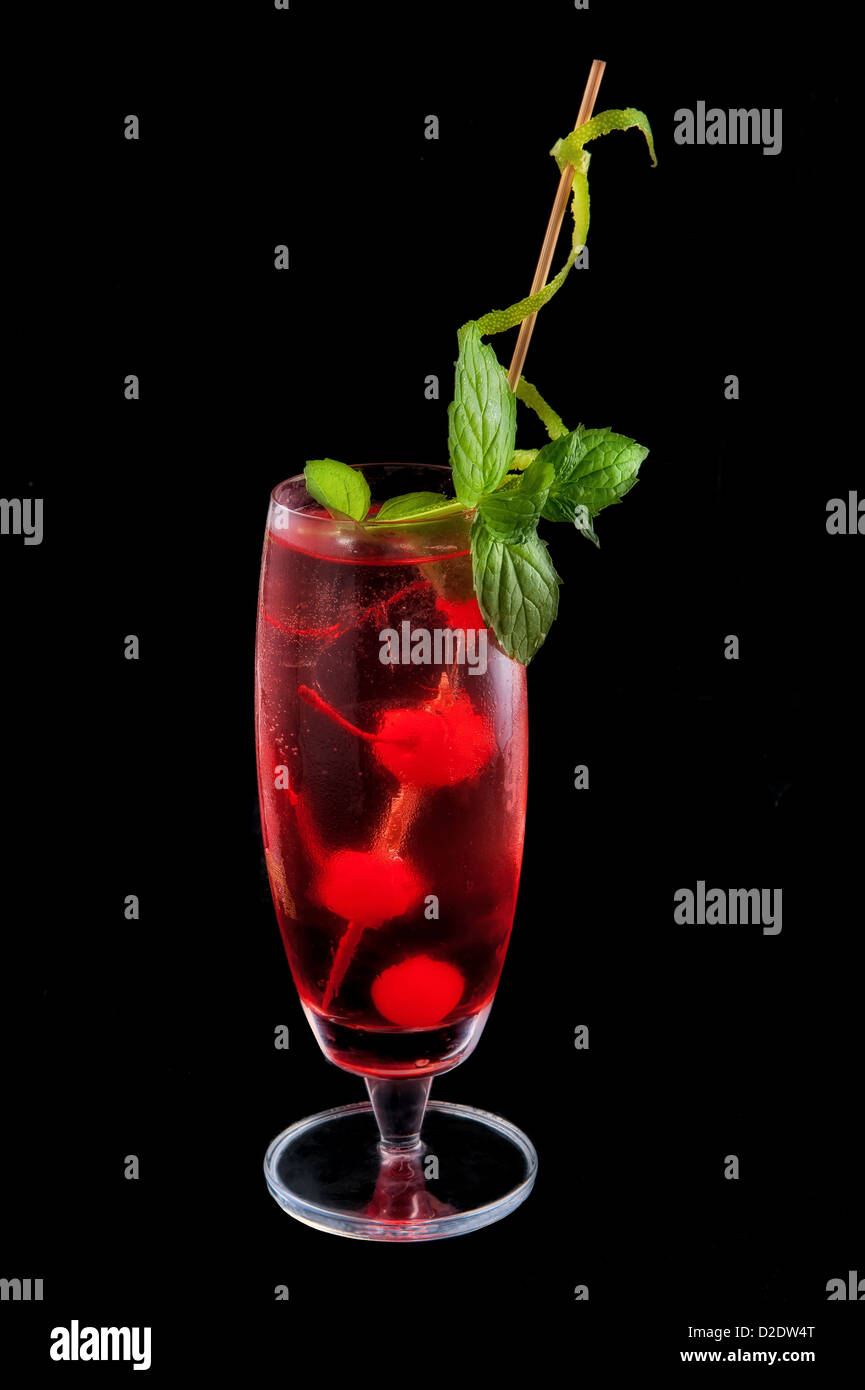 Alcohol cocktail drink with cherry, isolated black background Stock ...