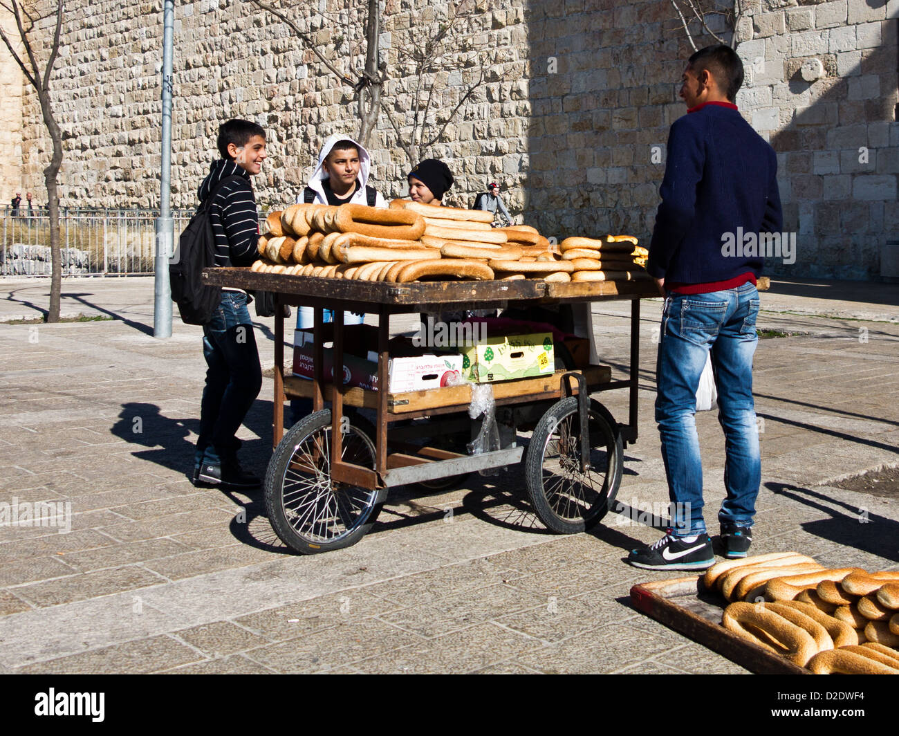 Young boys assemble near a bagel vendor near the Jaffa Gate Stock Photo ...