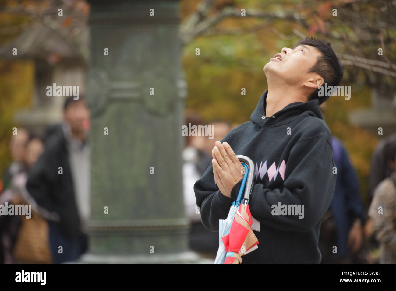Japanese people praying at the Kurama temple, northen of Kytoto, Japan ...
