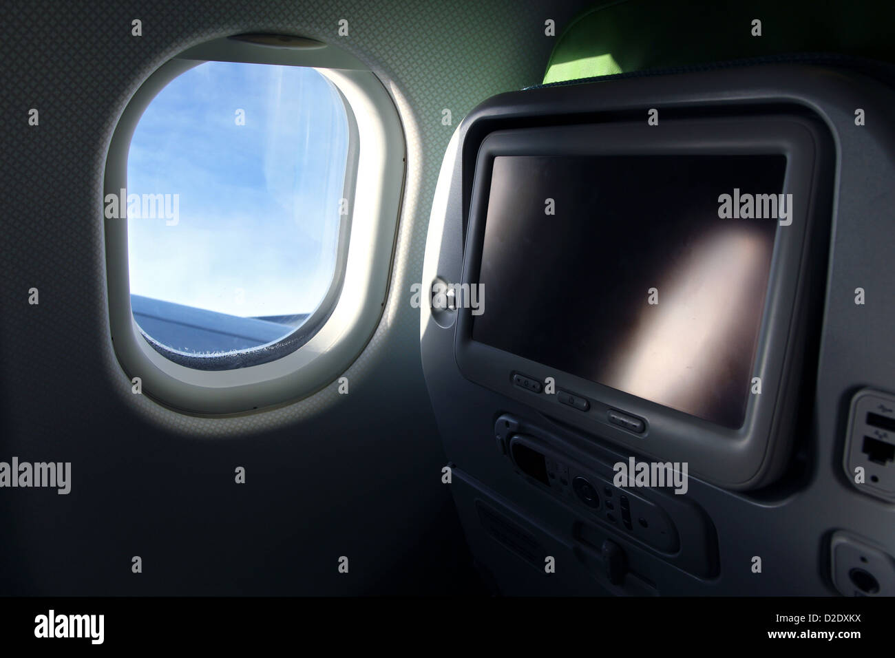 detail of airplane seat with tv screen Stock Photo - Alamy