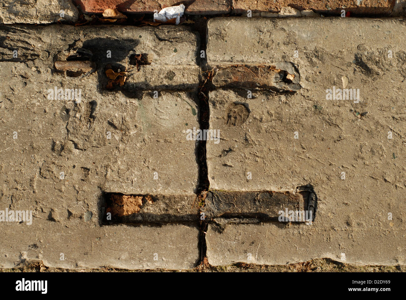 detail of iron staples set into paving stones Stock Photo - Alamy