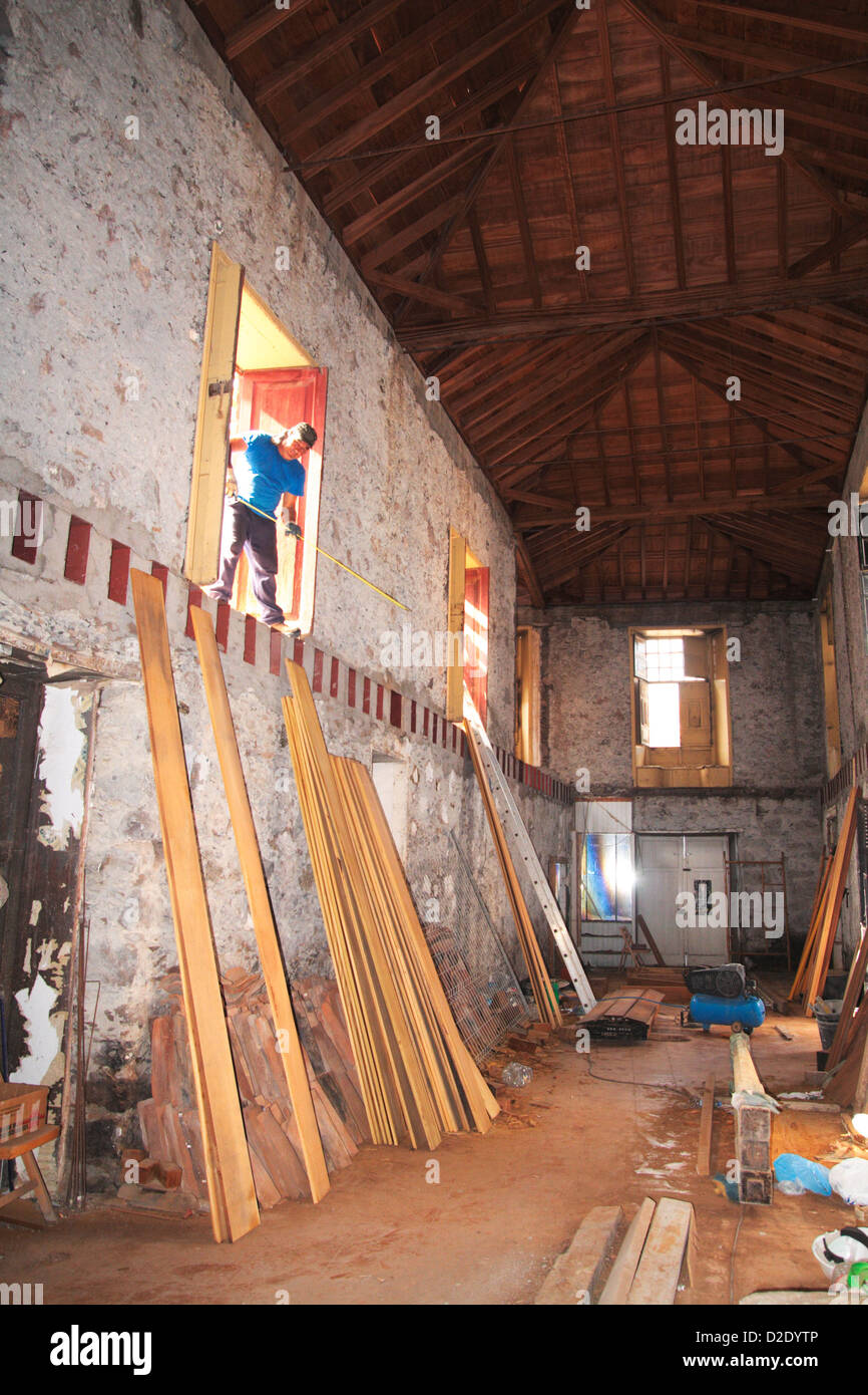 construction worker labouring inside a building Stock Photo - Alamy