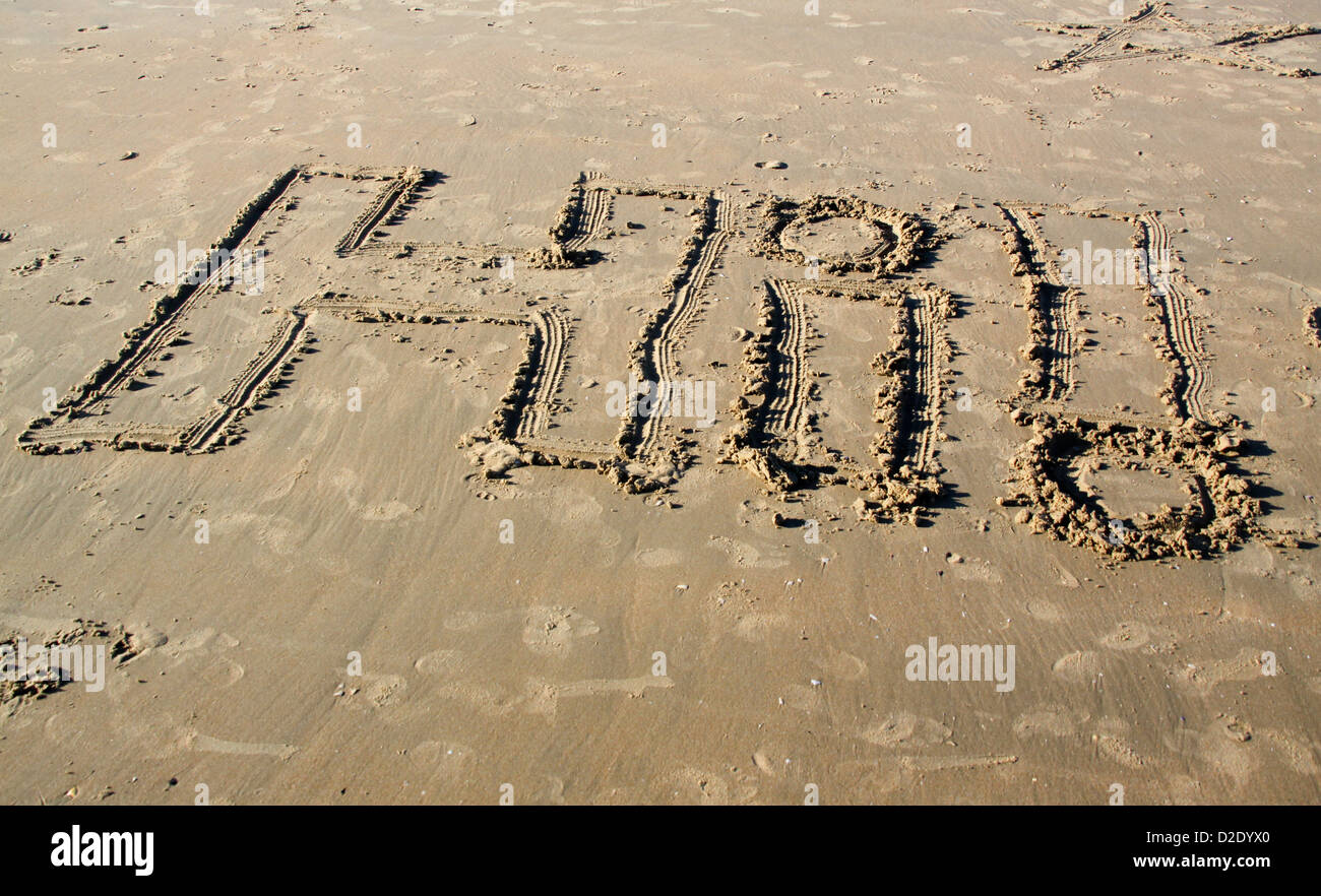Hi! written in sand on beach Stock Photo - Alamy