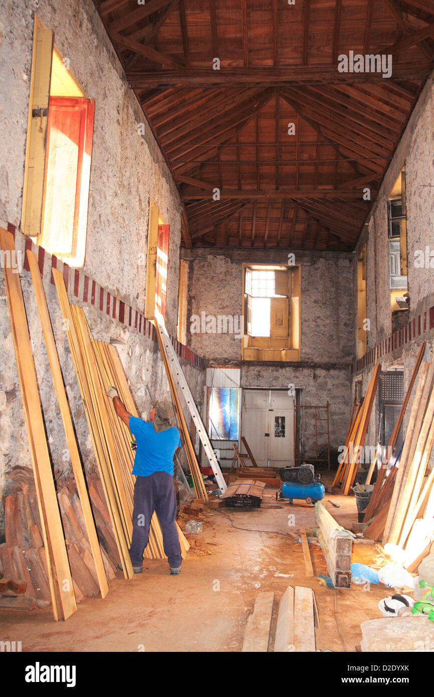 construction worker labouring inside a building Stock Photo - Alamy