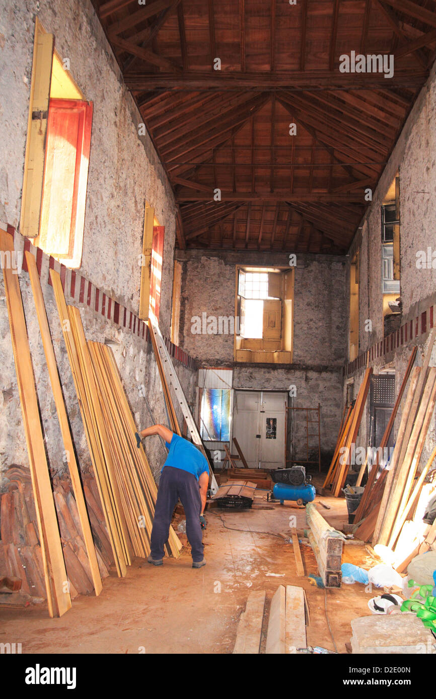 construction worker labouring inside a building Stock Photo - Alamy