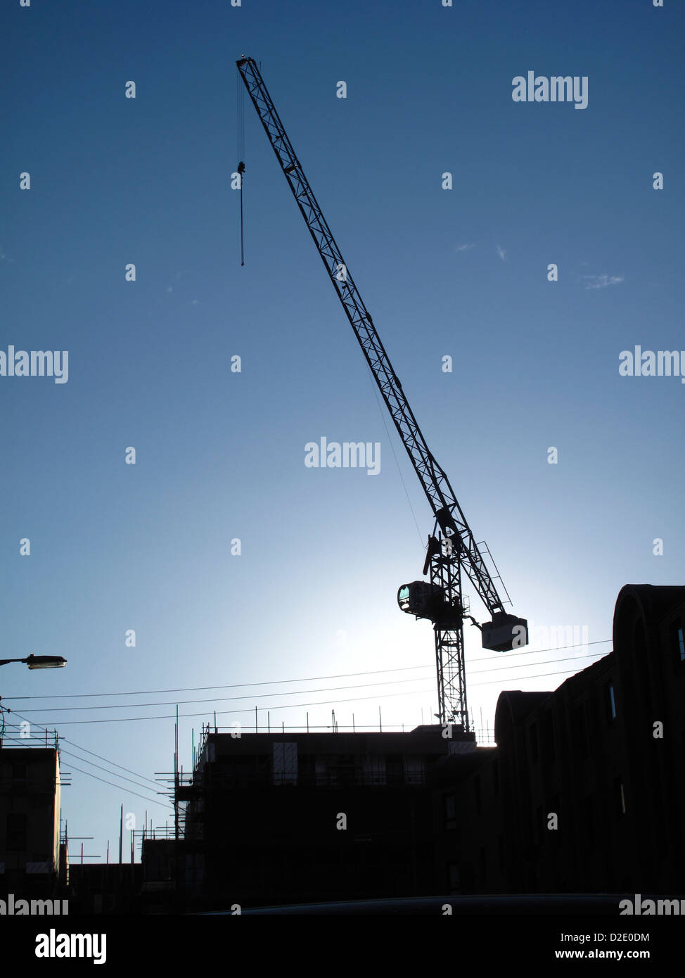 Silhouette of construction jib crane Stock Photo - Alamy