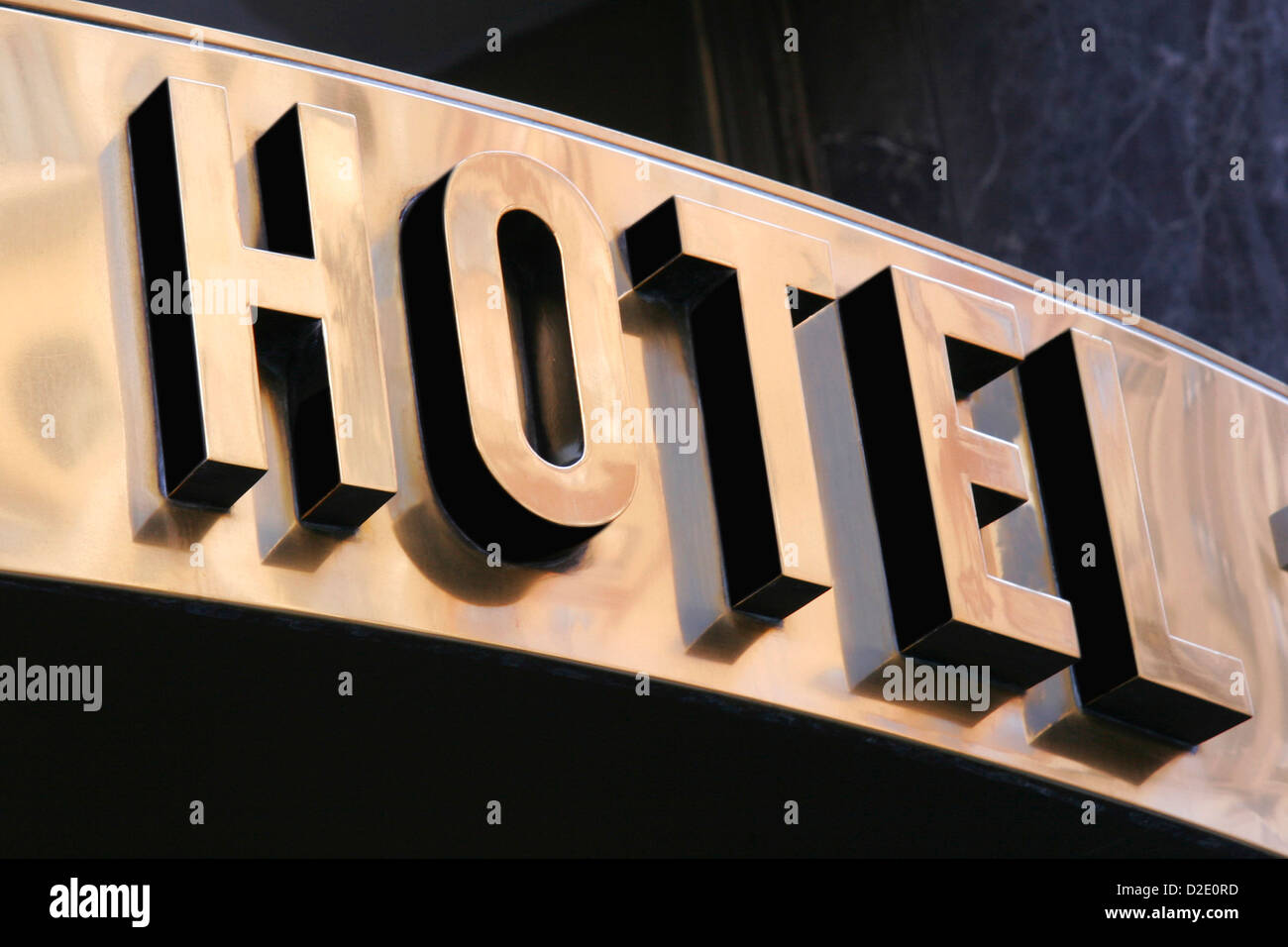 golden sign hotel in the city Stock Photo - Alamy