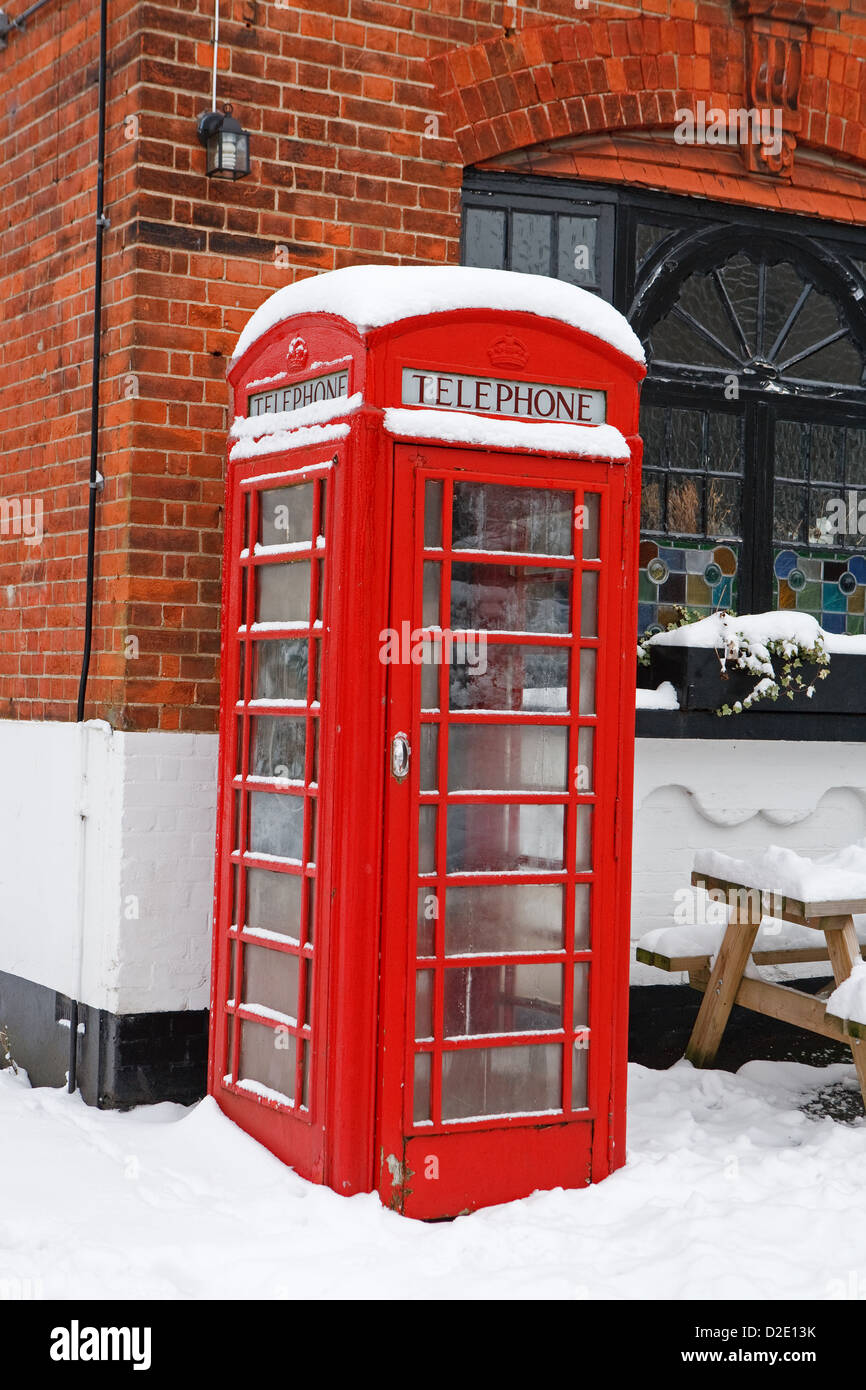 A red public telephone box covered in snow in Downe Village Kent Stock ...