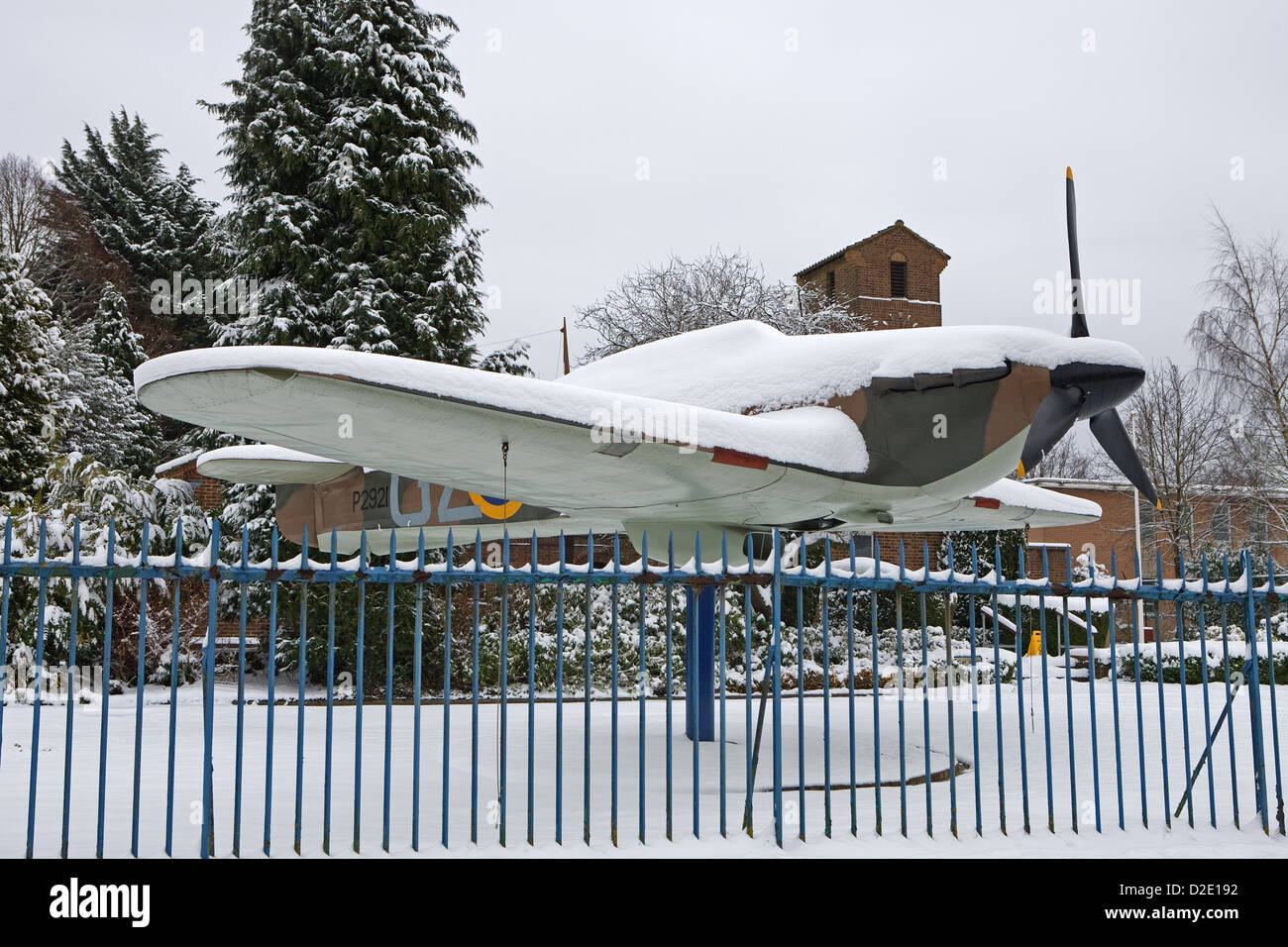 A spitfire covered in snow, gate guardian at the RAF chapel in Biggin ...