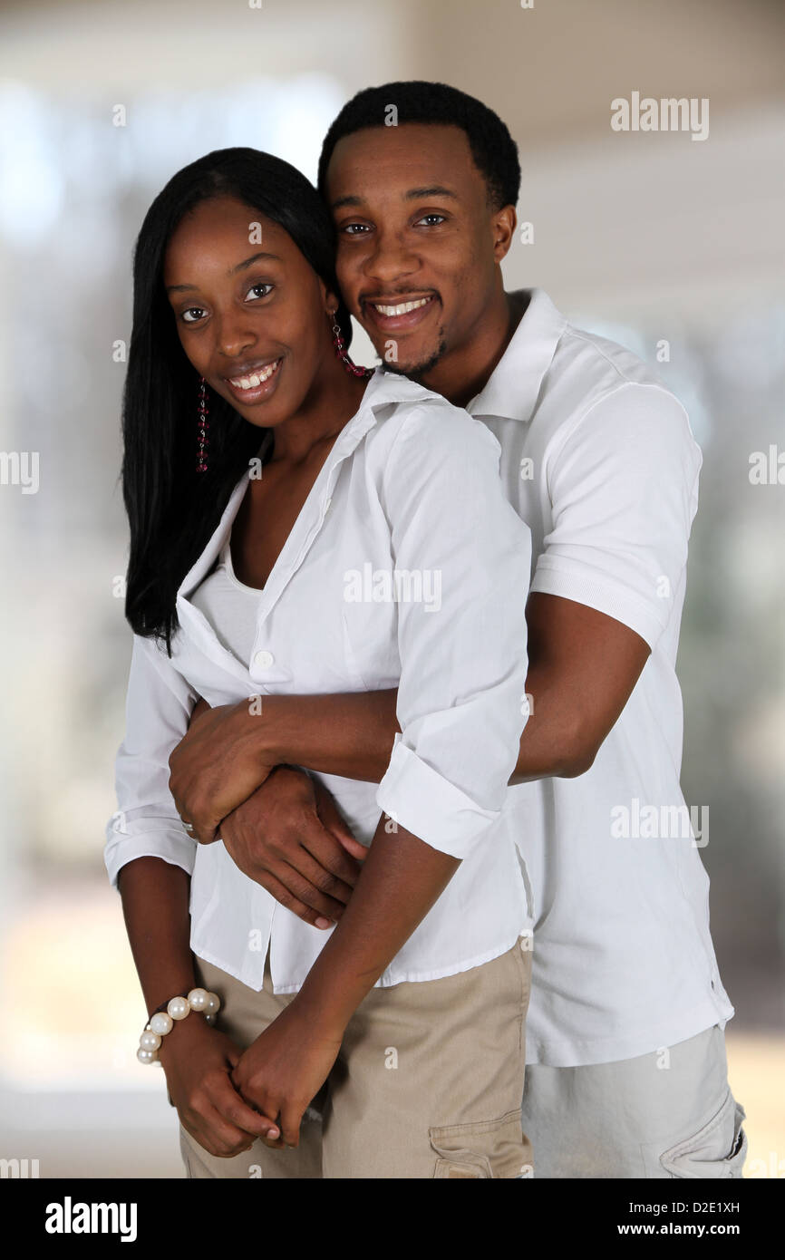 Man and woman posing together inside their home Stock Photo - Alamy