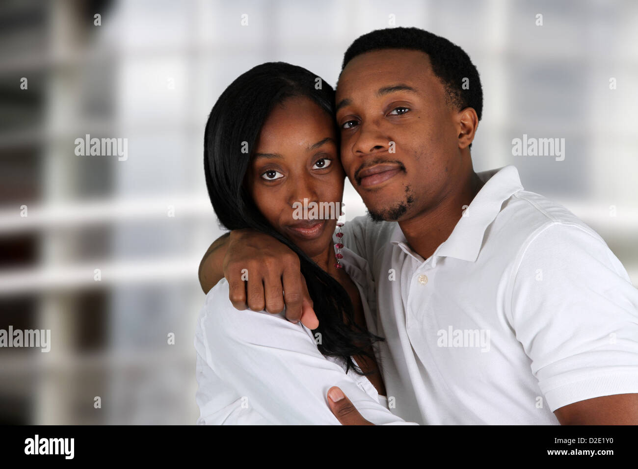Man and woman posing together inside their home Stock Photo - Alamy