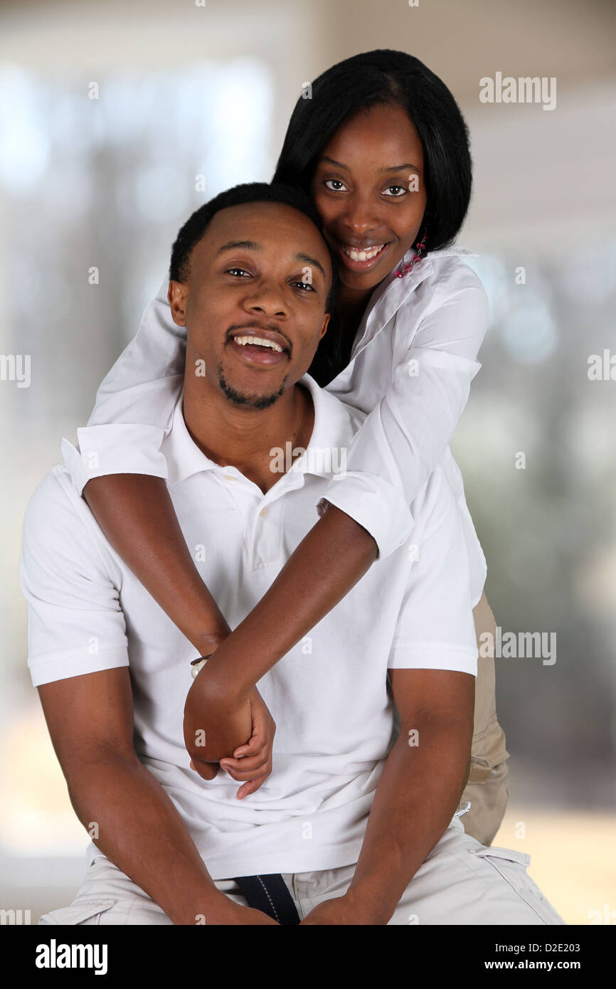 Man and woman posing together inside their home Stock Photo - Alamy