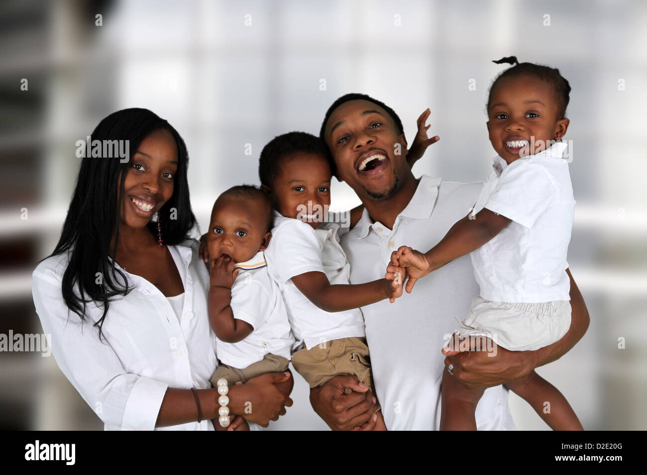 African American family together inside their home Stock Photo - Alamy