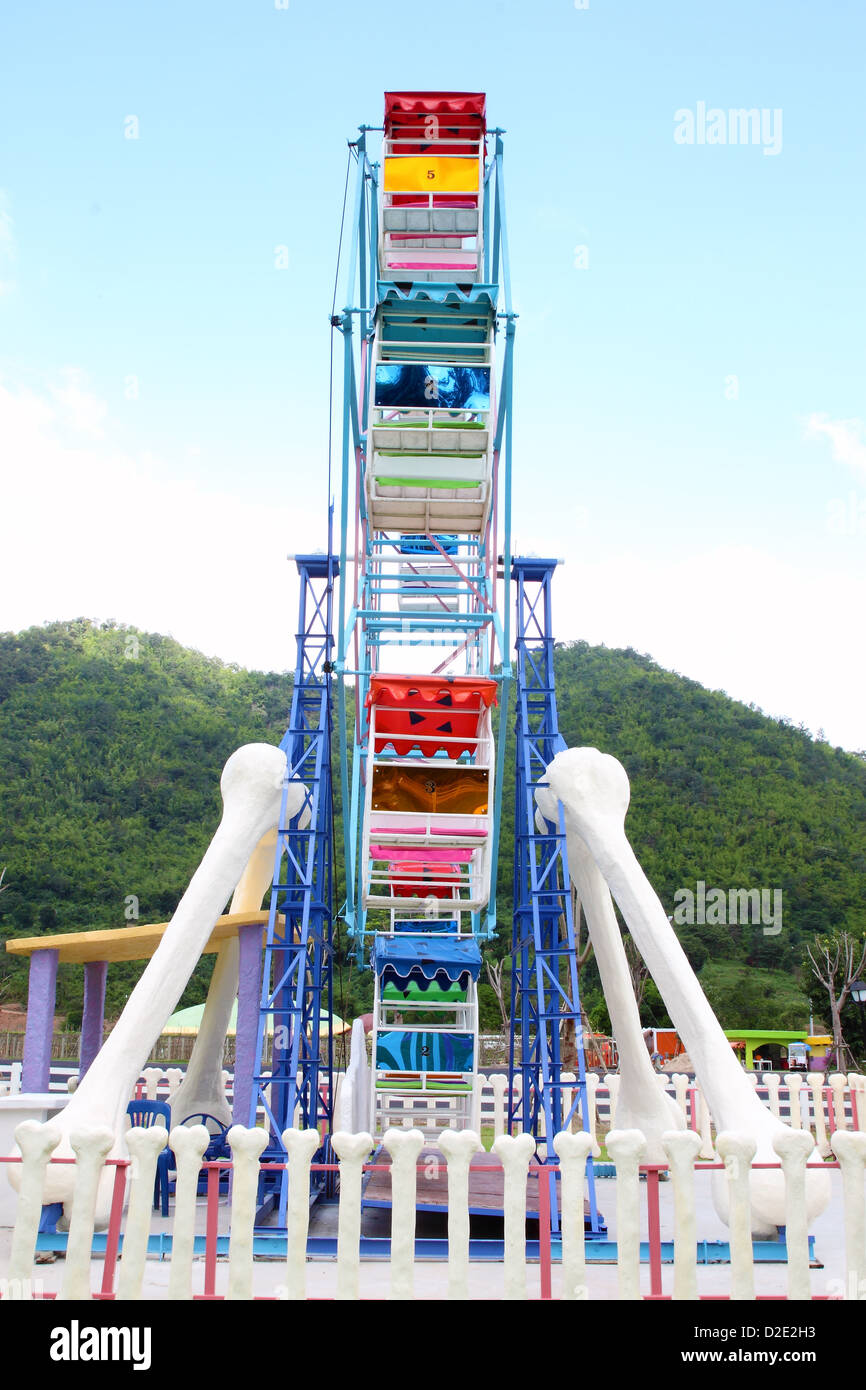 a colourful ferris wheel in the park (side view Stock Photo - Alamy