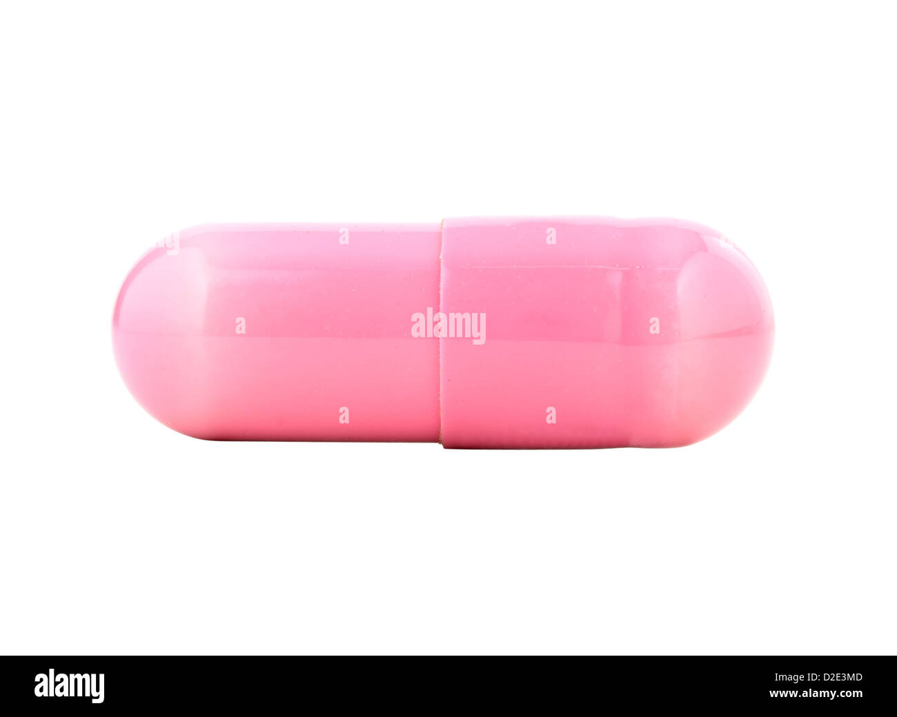 close-up of pink medical capsule on white background Stock Photo - Alamy