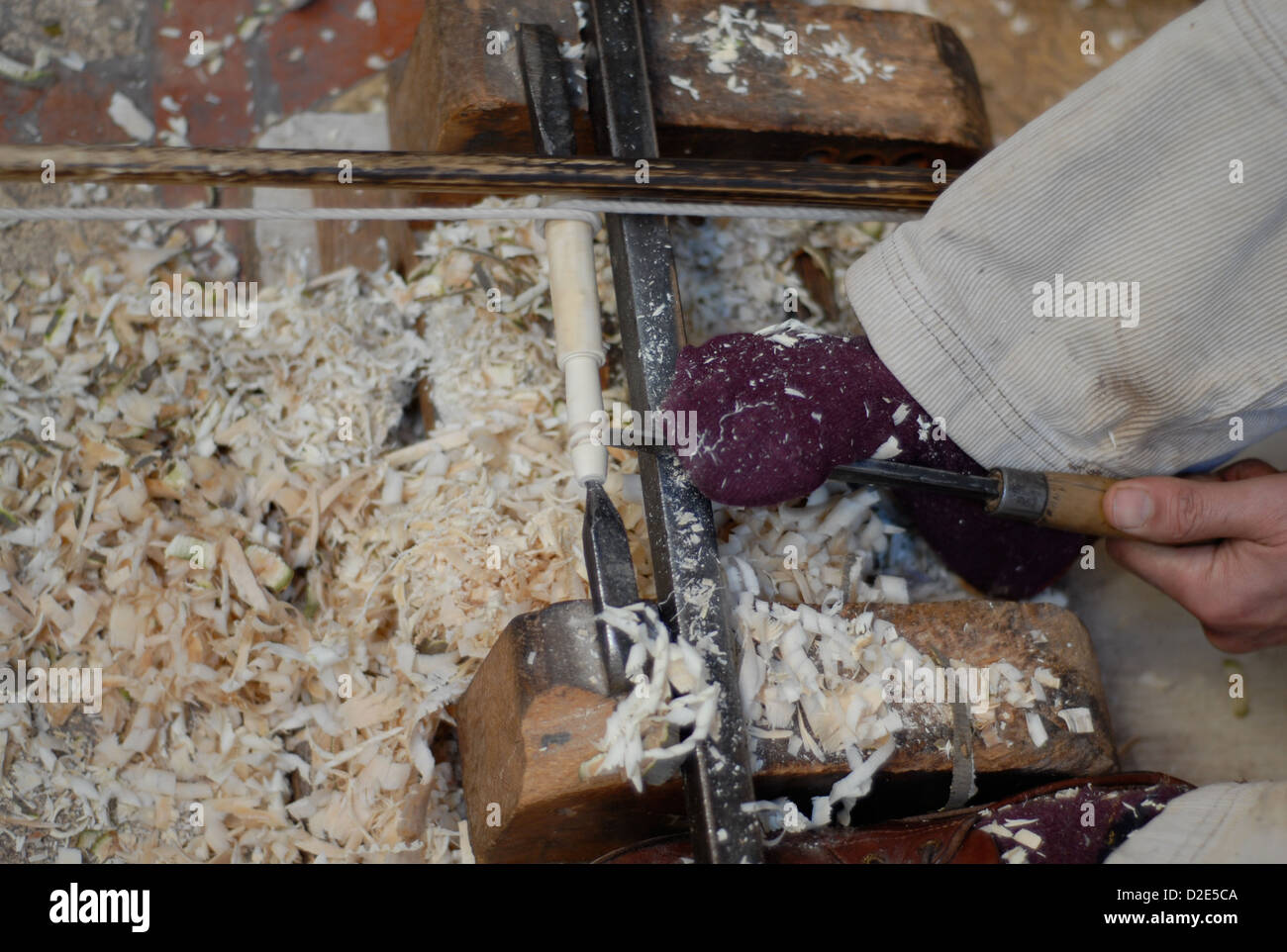 wood carver at work on a man powered lathe in marrakesh Stock Photo - Alamy