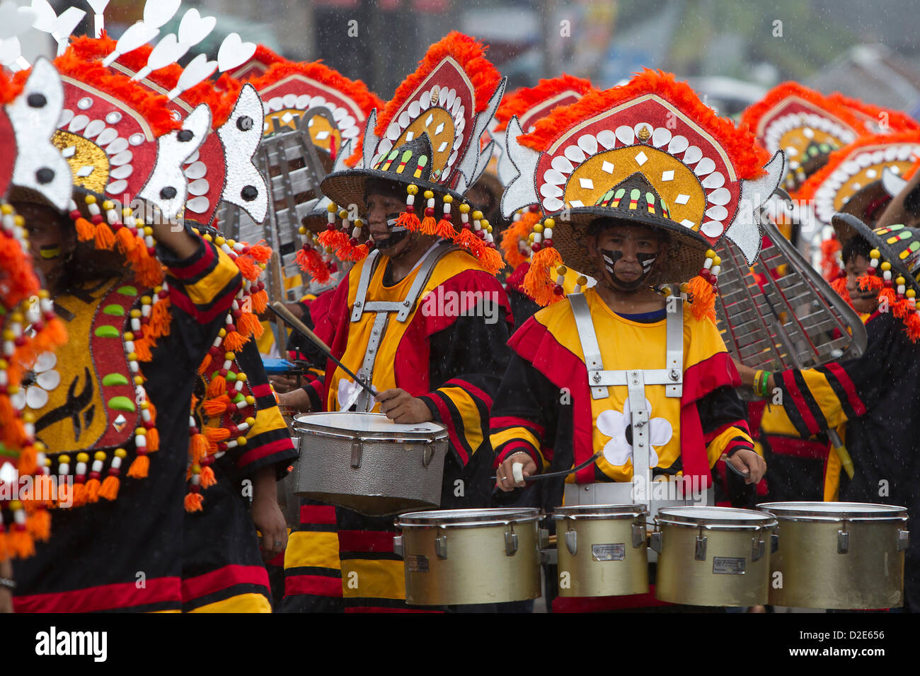 rain falls on street dancing participants, Ati-Atihan festival 2013 ...