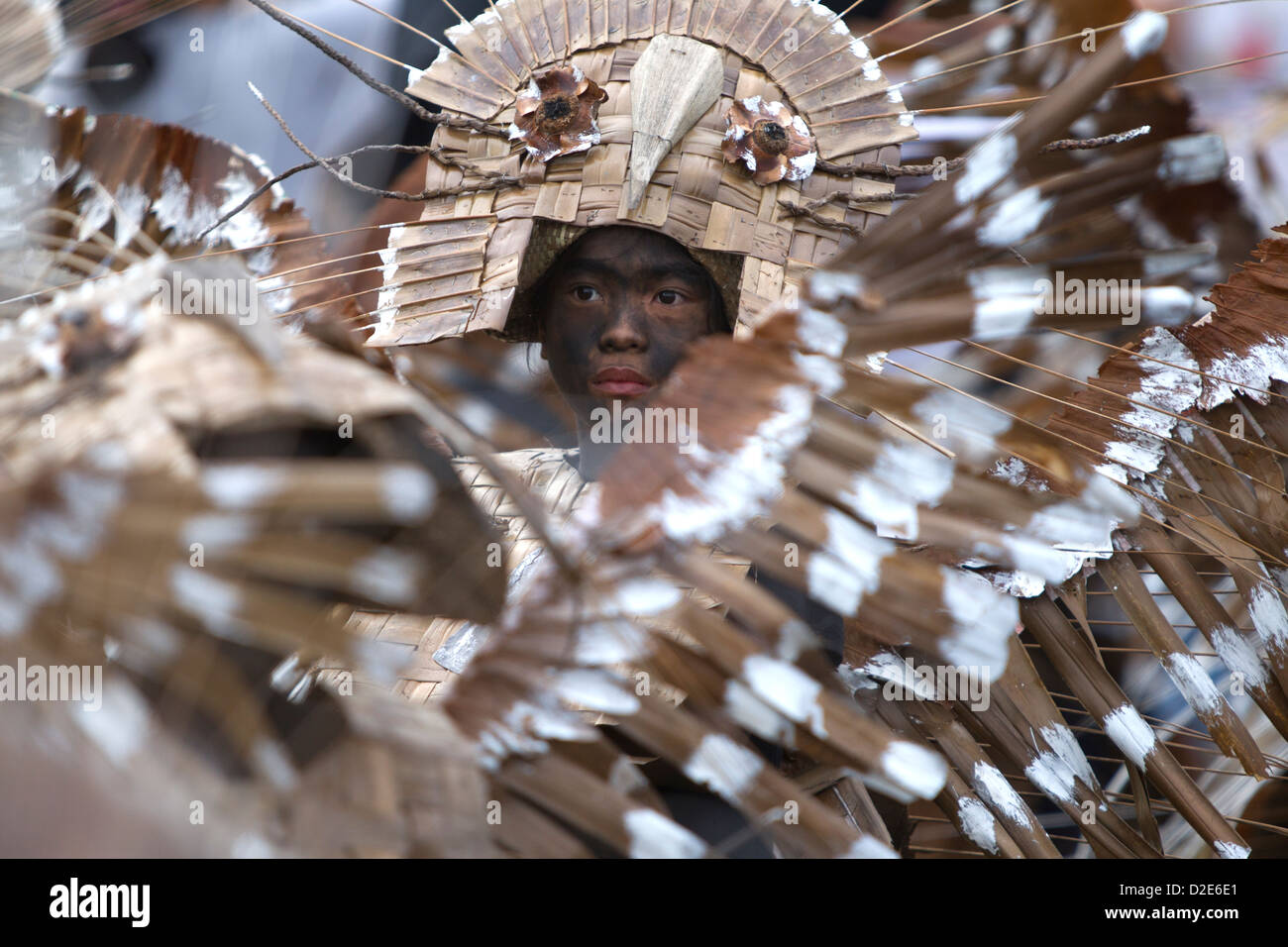 child dressed in tribal costume during street dancing procession, Ati ...