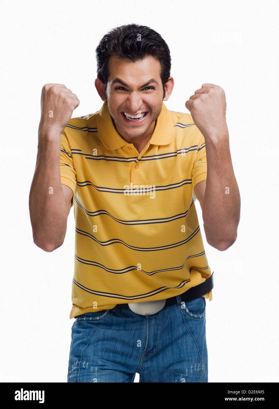 Portrait of a man clenching his fists in excitement Stock Photo - Alamy