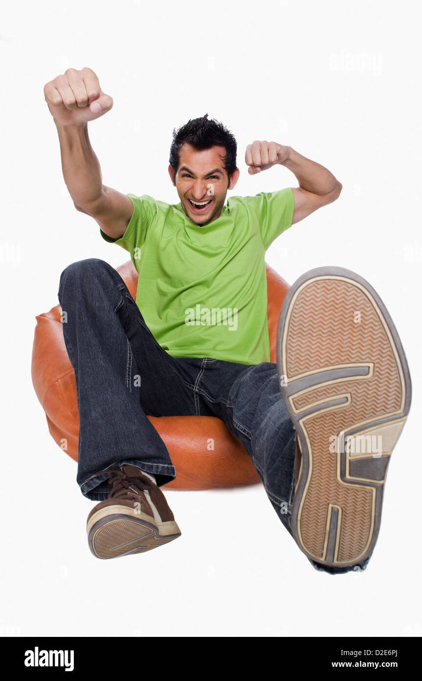 Man sitting on bean bag Cut Out Stock Images & Pictures - Alamy