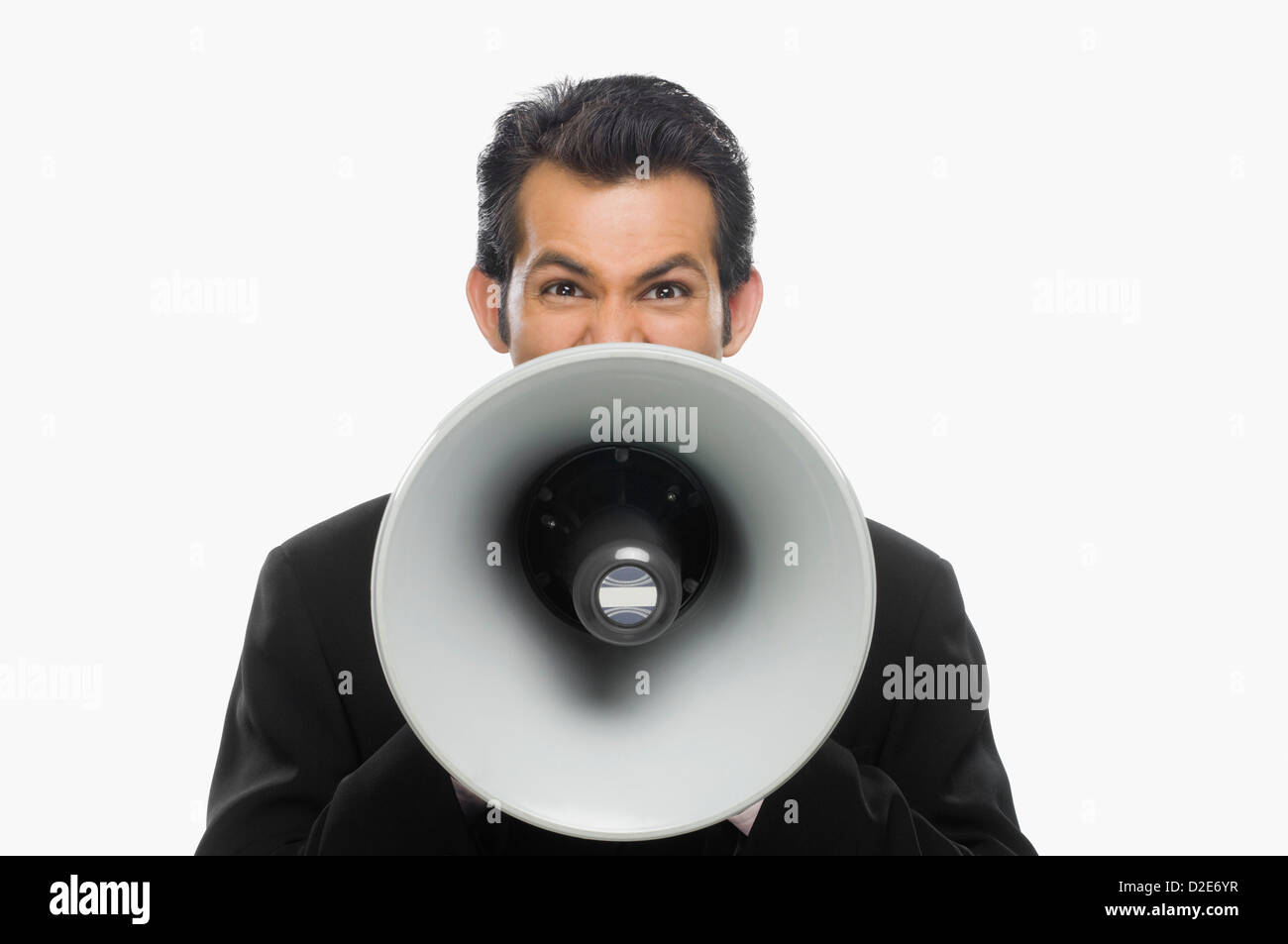 Businessman shouting into a megaphone Stock Photo - Alamy