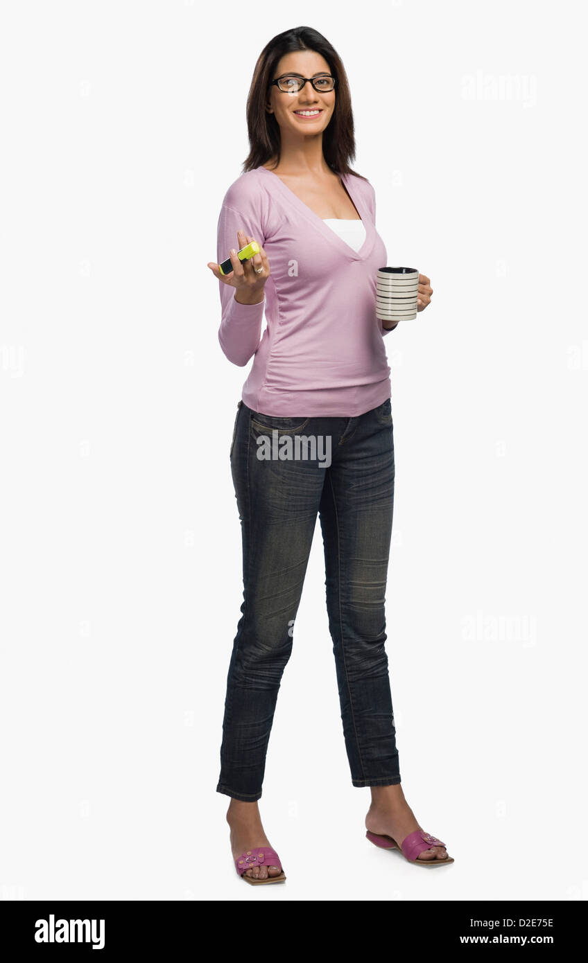 Female fashion designer drinking coffee Stock Photo - Alamy