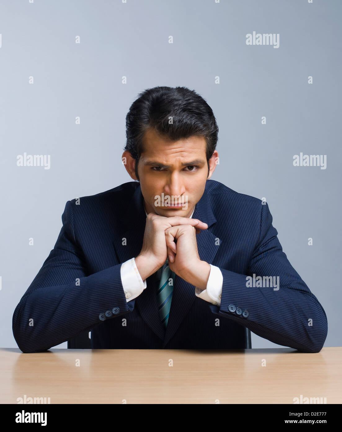 Portrait of a businessman thinking Stock Photo - Alamy
