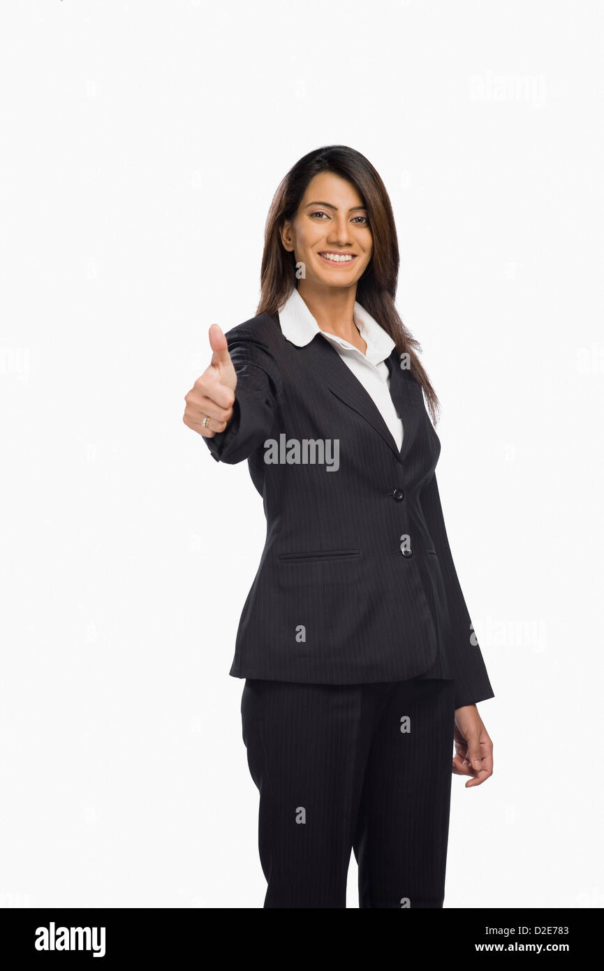Businesswoman showing thumbs up sign and smiling Stock Photo - Alamy Businesswoman showing thumbs up sign and smiling Stock Photo - Alamy
