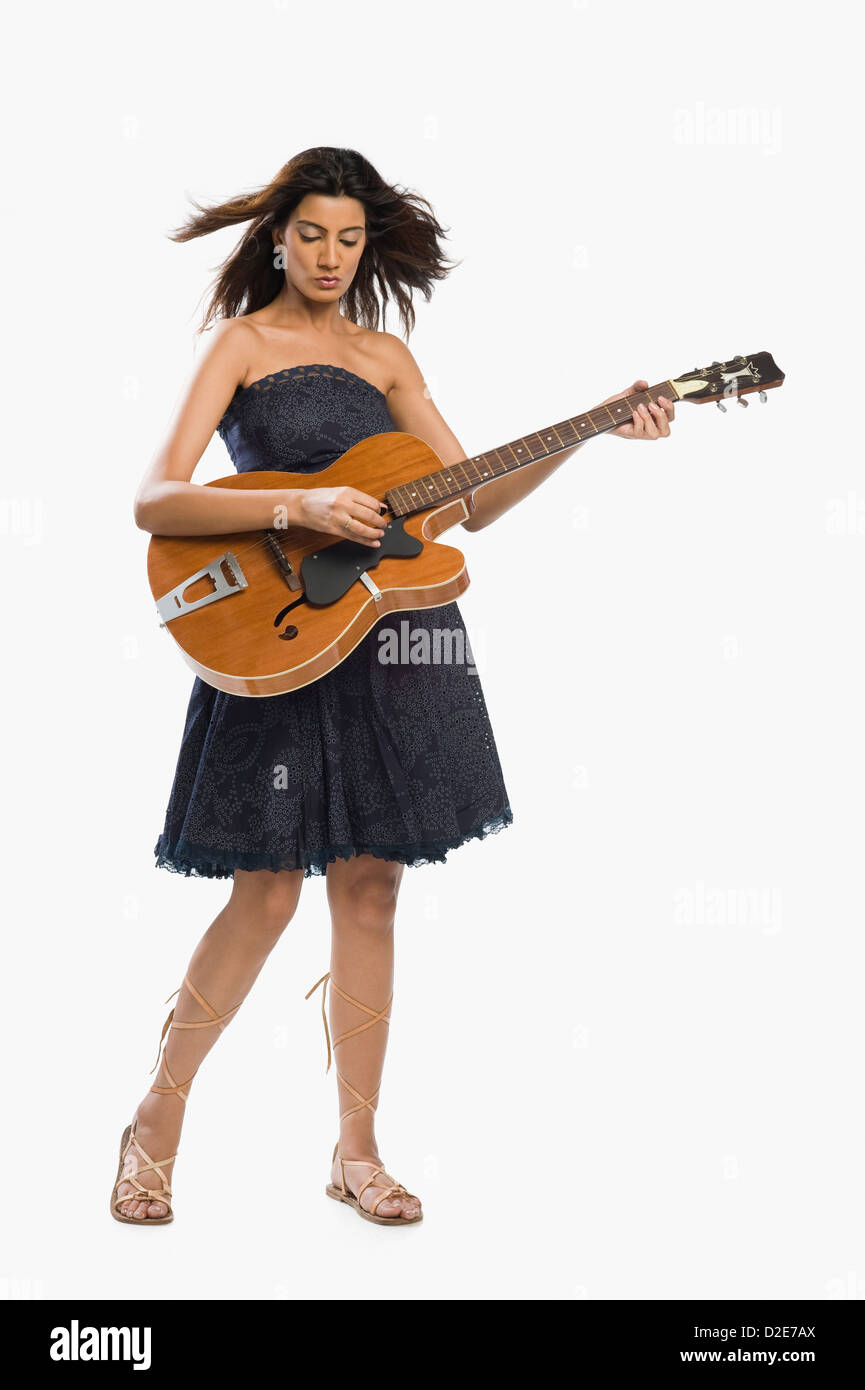 Woman playing guitar background Cut Out Stock Images & Pictures - Alamy