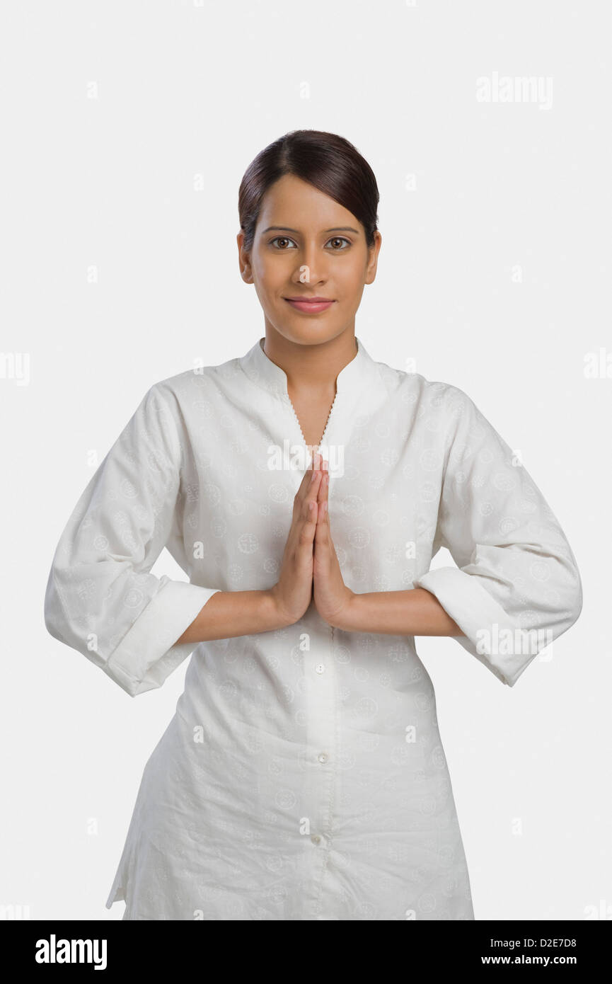 Portrait of a woman greeting Stock Photo - Alamy