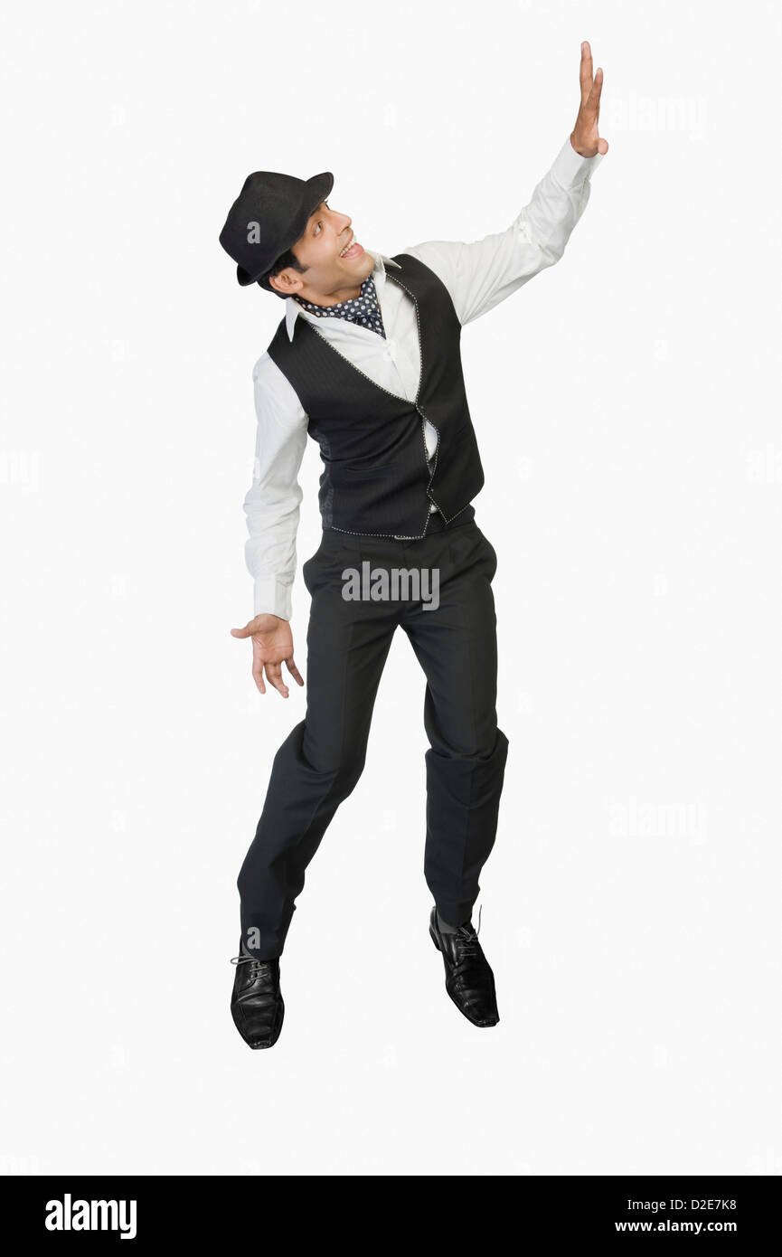 Businessman showing stop gesture and smiling Stock Photo - Alamy