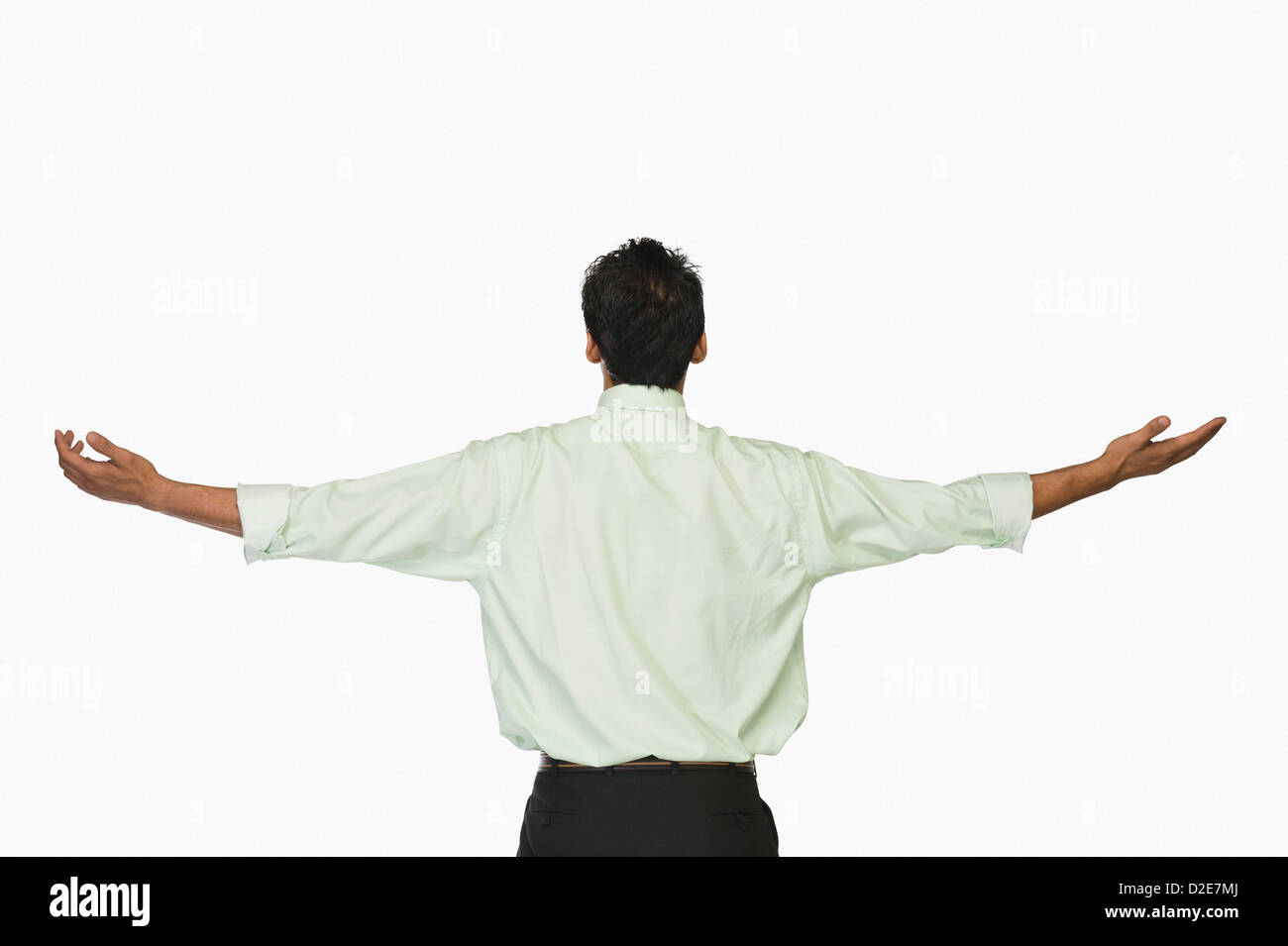 Rear view of a businessman with his arms outstretched Stock Photo - Alamy