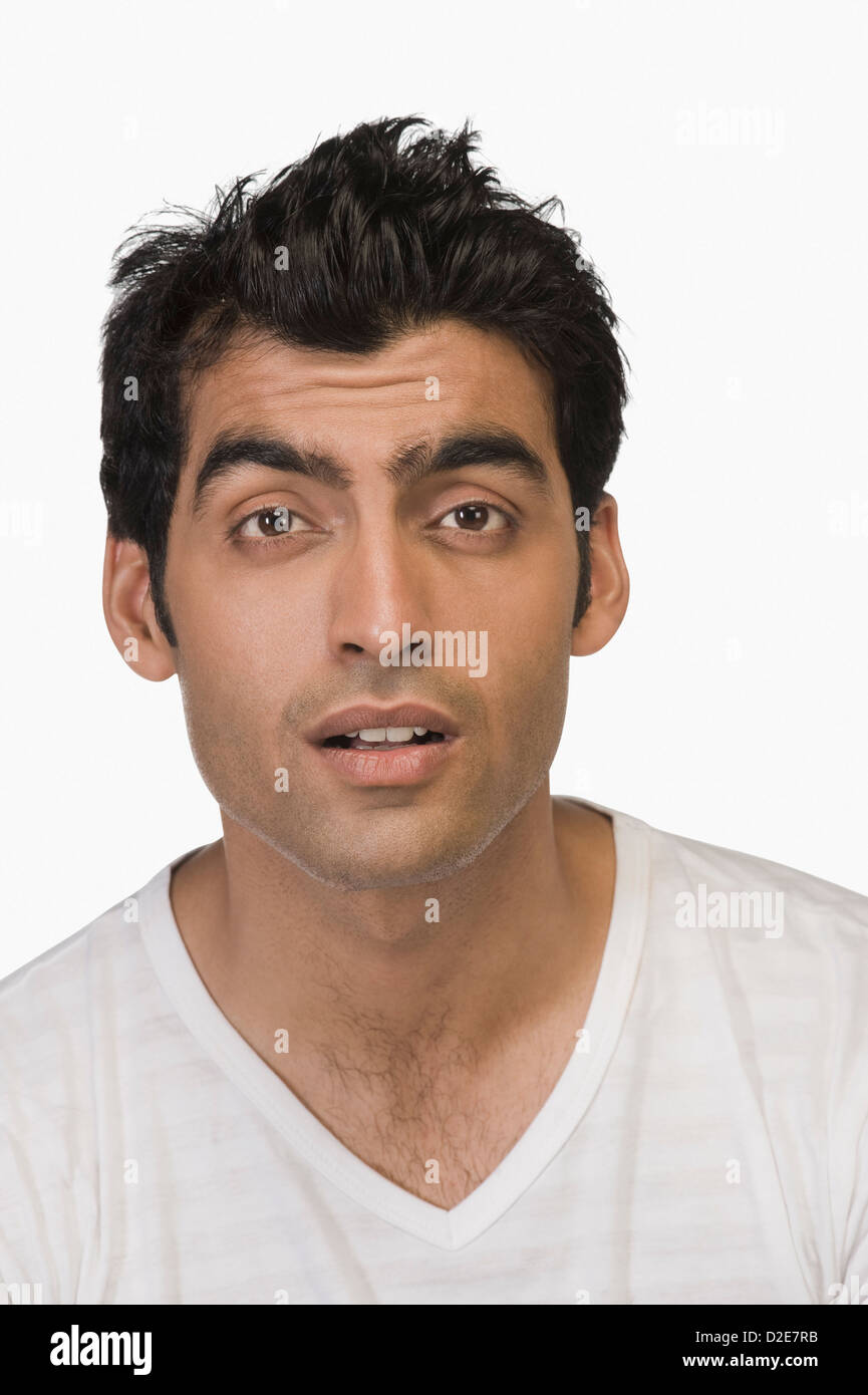Portrait of a man looking surprised Stock Photo - Alamy