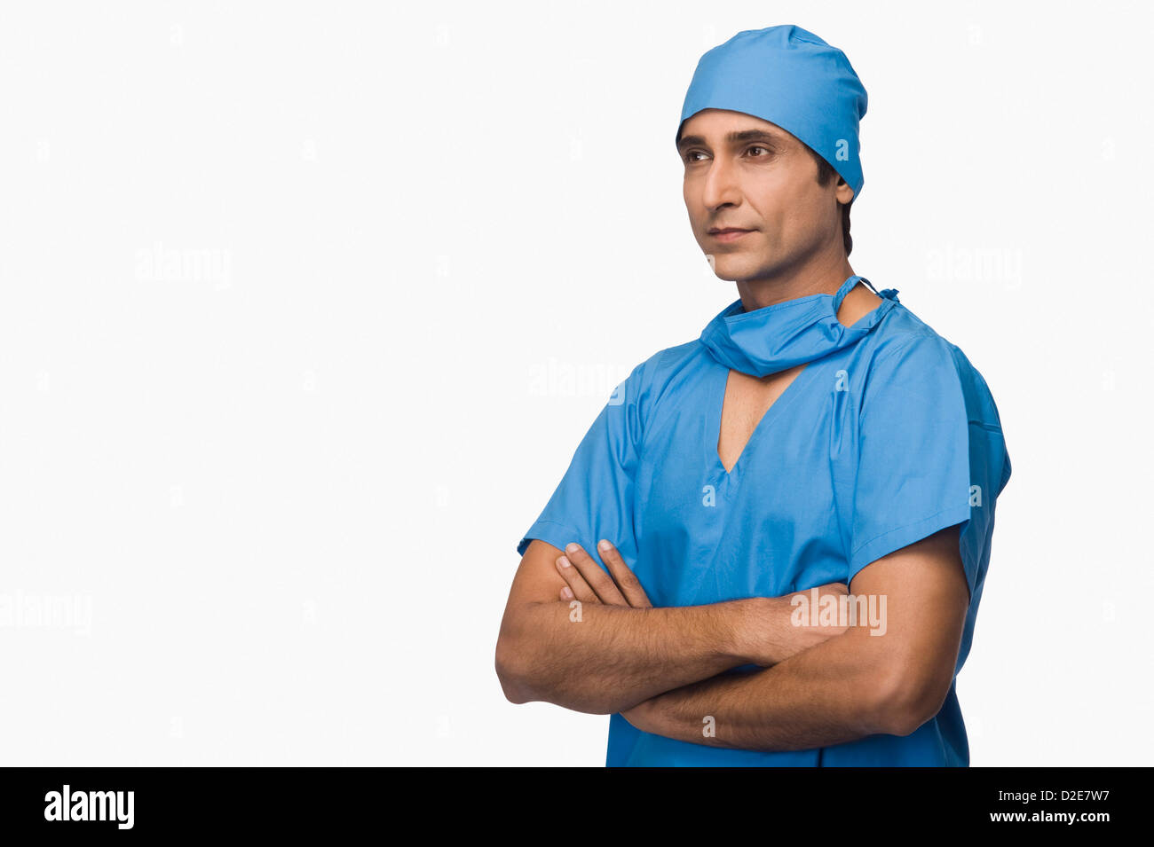 Doctor standing with arms crossed Stock Photo - Alamy