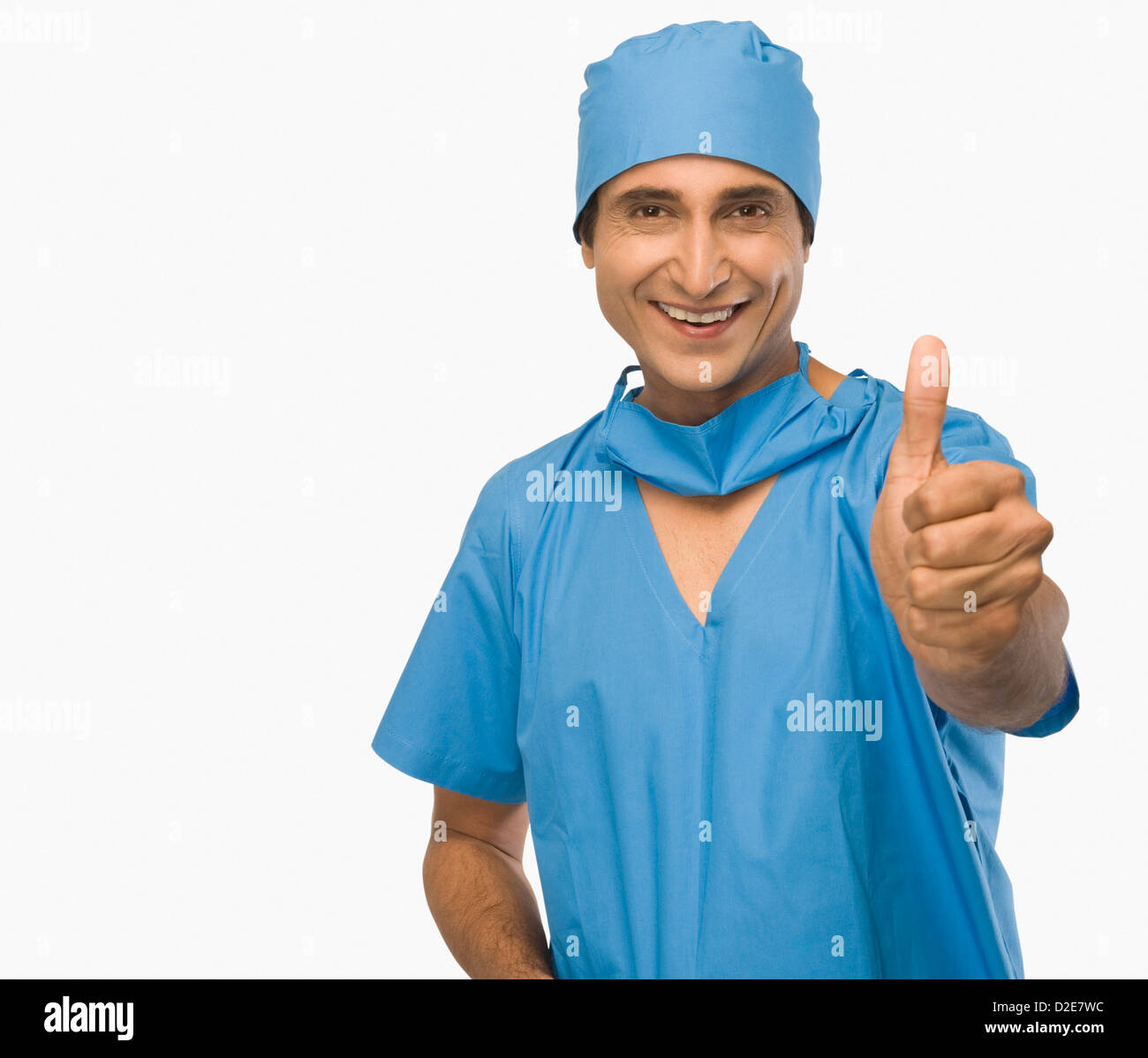 Portrait of a surgeon showing thumbs up and smiling Stock Photo - Alamy