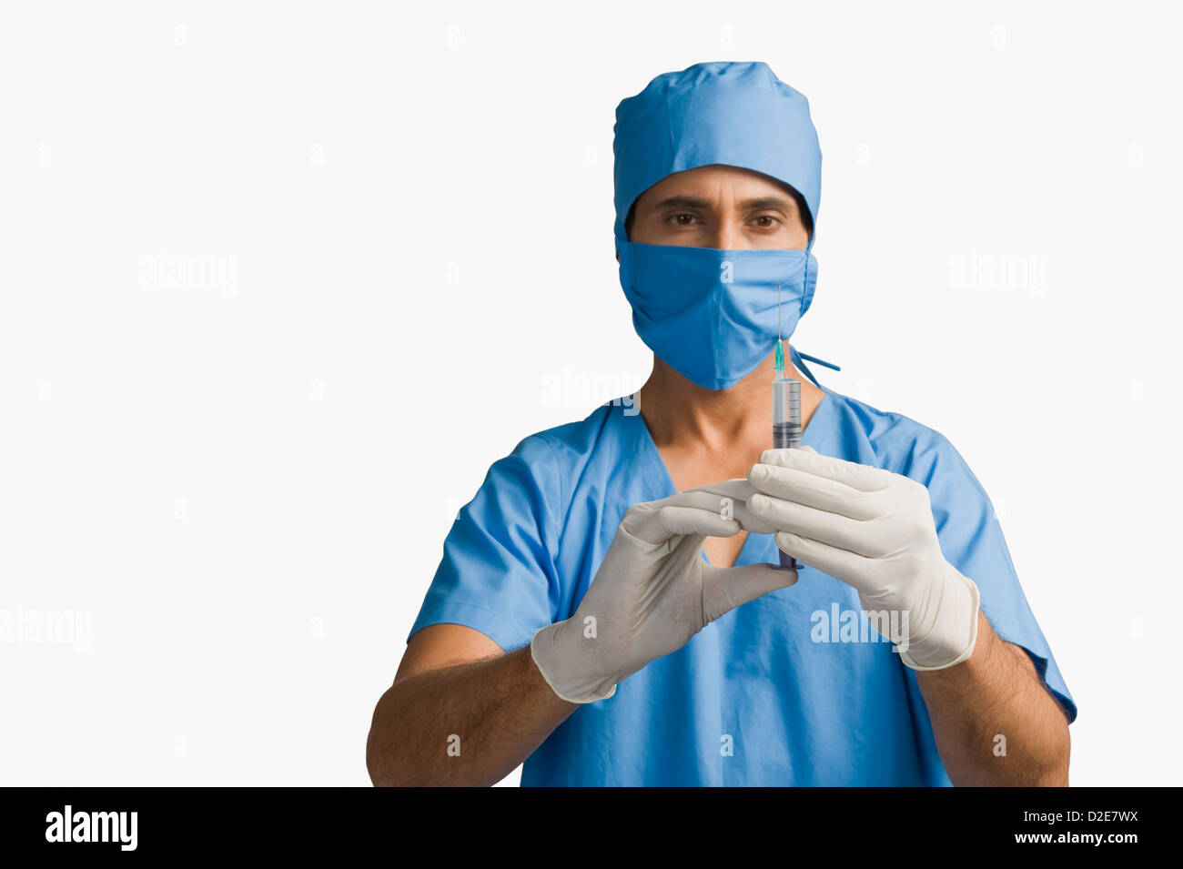Surgeon holding a syringe Stock Photo - Alamy