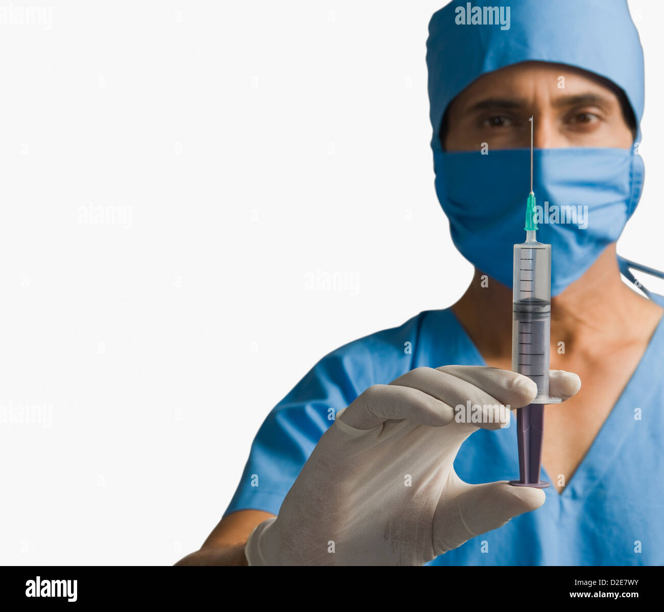 Surgeon holding a syringe Stock Photo - Alamy