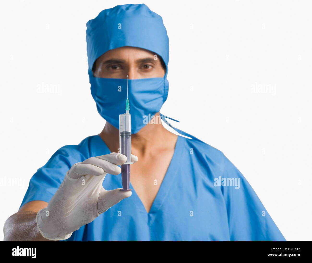 Surgeon holding a syringe Stock Photo - Alamy