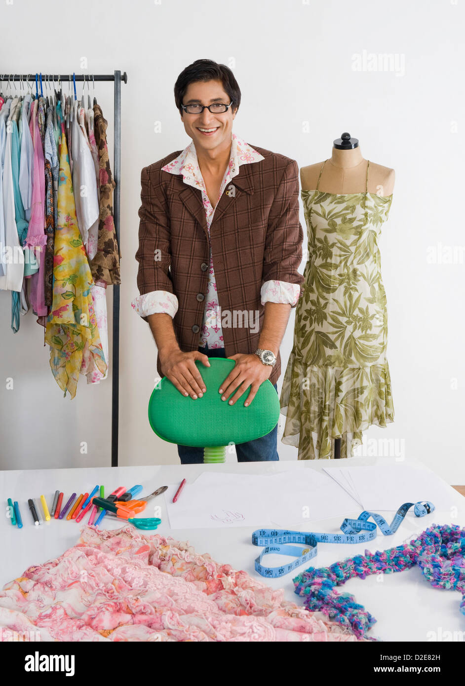 Portrait of a tailor smiling in a clothing store Stock Photo - Alamy