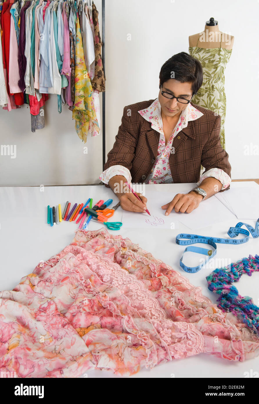Tailor working in a clothing store Stock Photo - Alamy