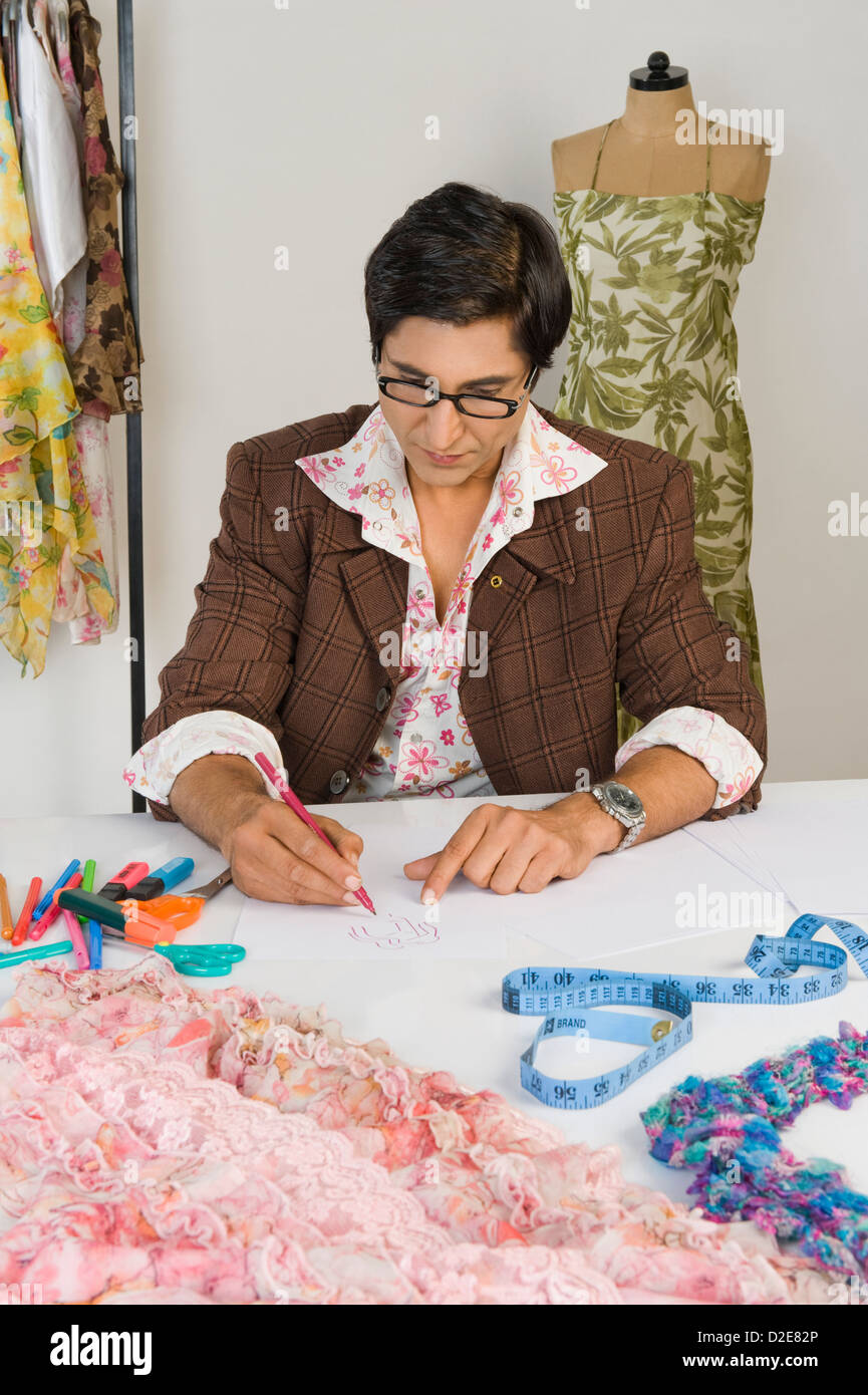 Tailor working in a clothing store Stock Photo - Alamy