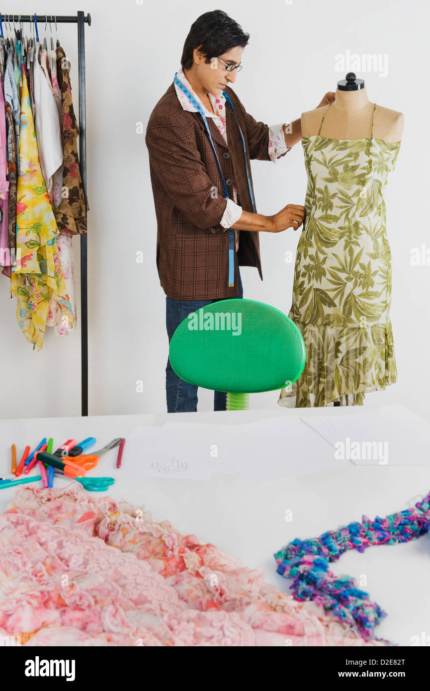 Tailor working in a clothing store Stock Photo - Alamy