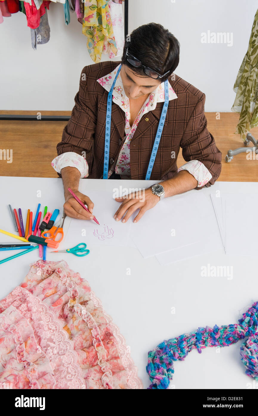 Tailor working in a clothing store Stock Photo - Alamy