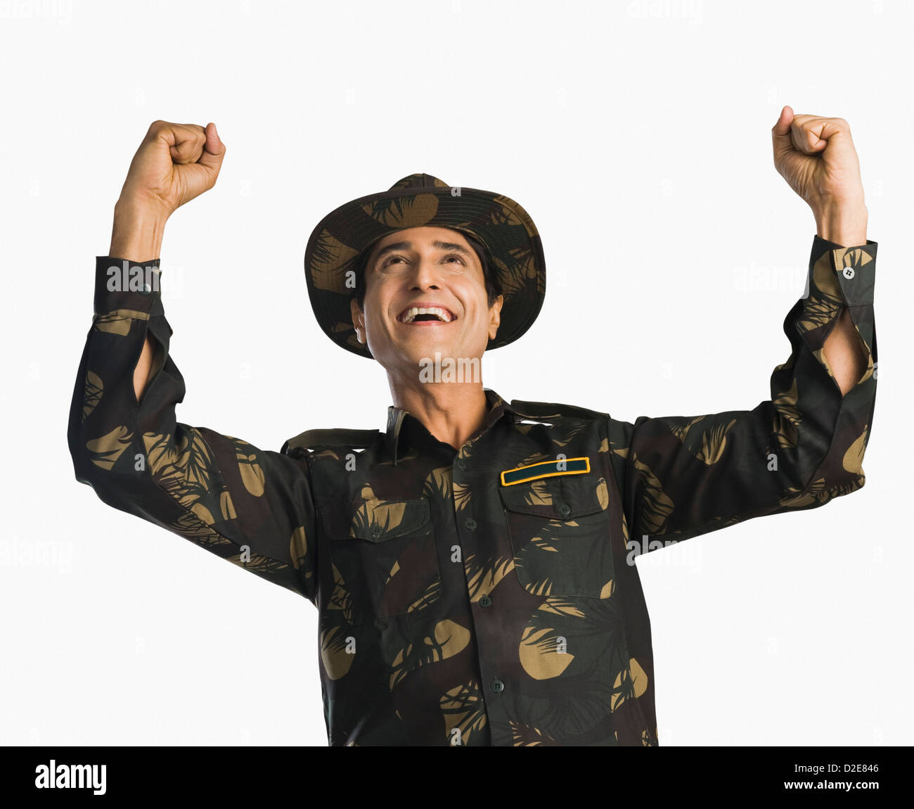 Army soldier cheering with arms raised Stock Photo - Alamy