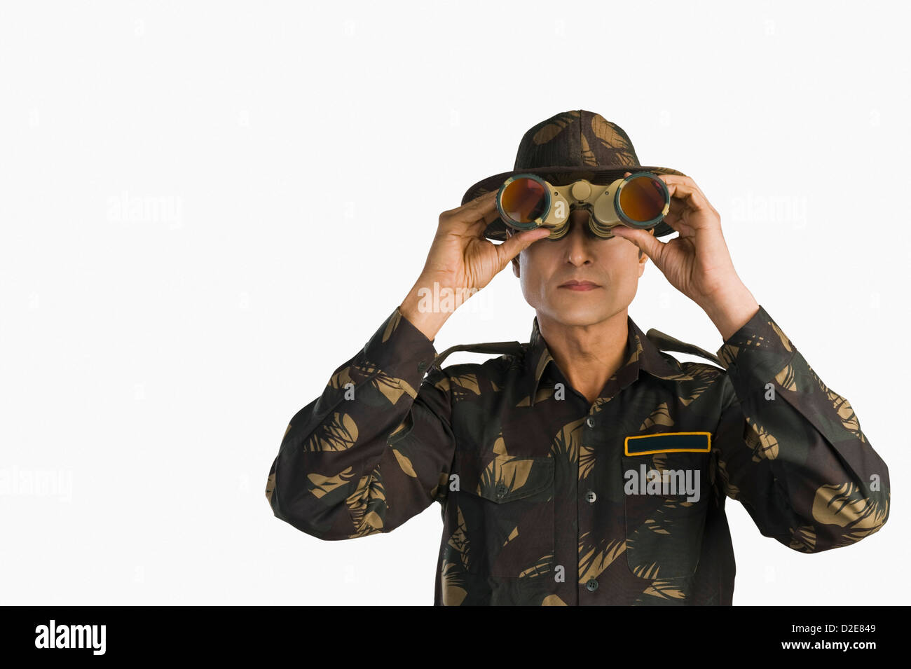 Army soldier looking through binoculars Stock Photo - Alamy