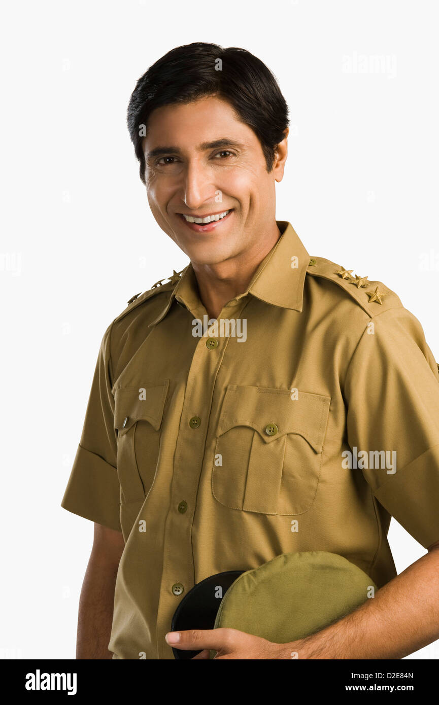 Portrait of a police officer smiling Stock Photo - Alamy