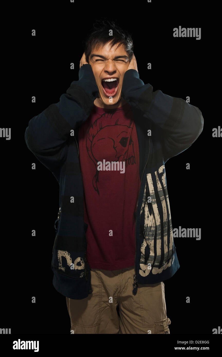 Screaming man hands in ears hi-res stock photography and images - Alamy