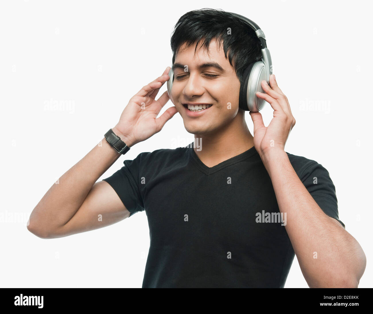 Man listening to headphones Stock Photo - Alamy