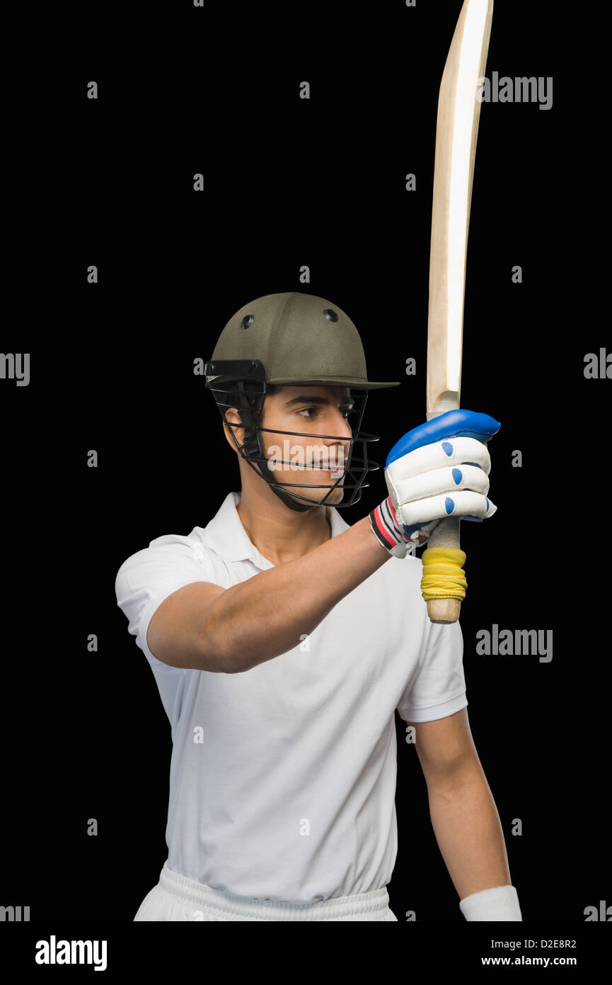 Cricket batsman raising his bat Stock Photo - Alamy